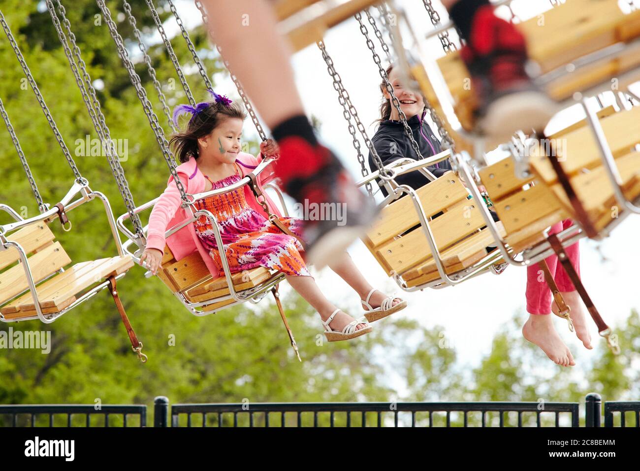 kids enjoying the ride on a carousel during a sunny afternoon at ...