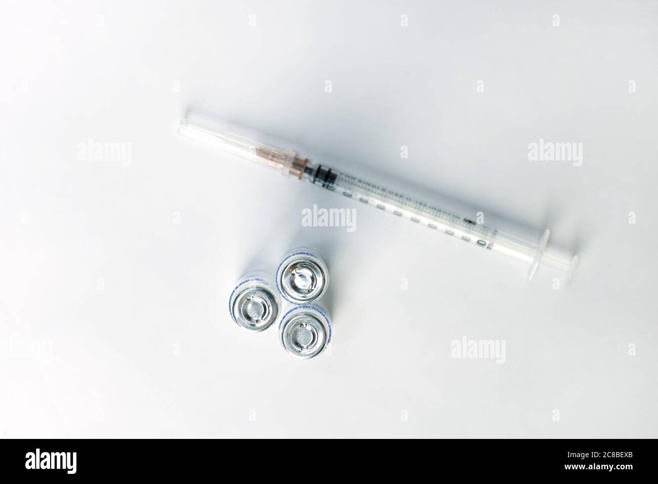 syringe and medicine for injection on white background. Top view, flat ...