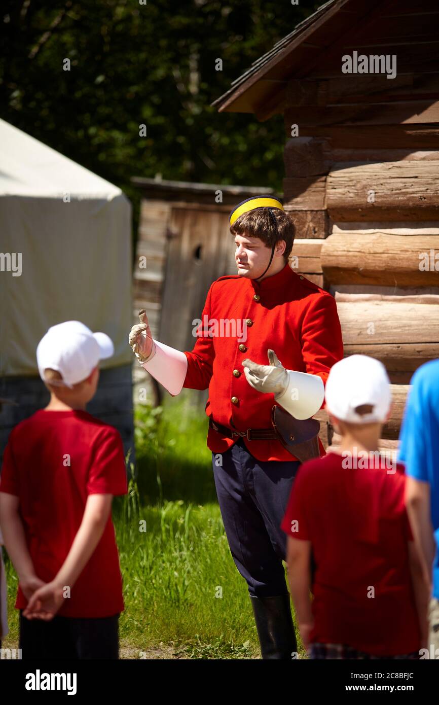 A historian guide teaching and illustrating how life was back in the ...