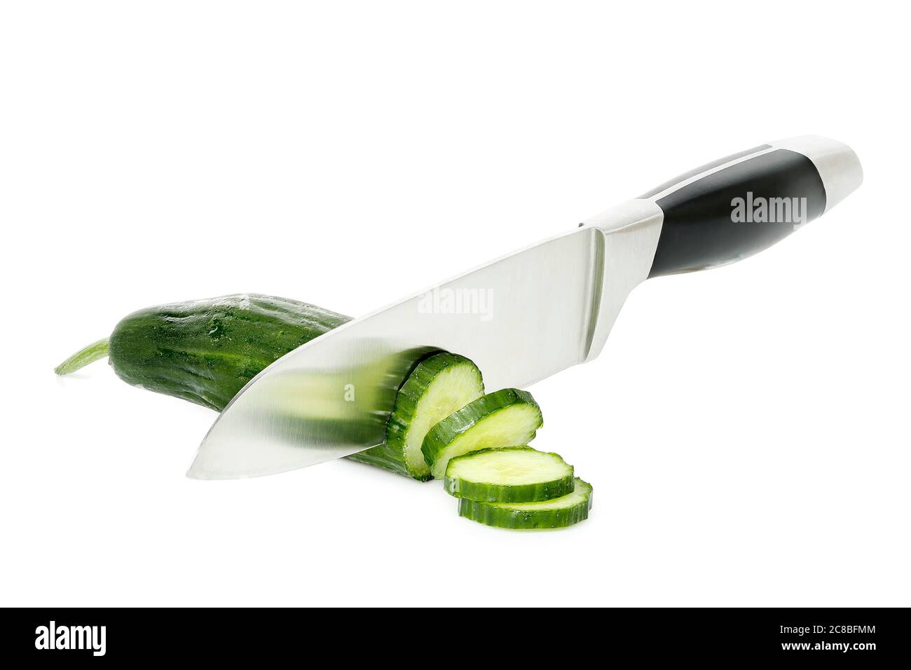 chef knife slicing a cucumber on white Stock Photo - Alamy