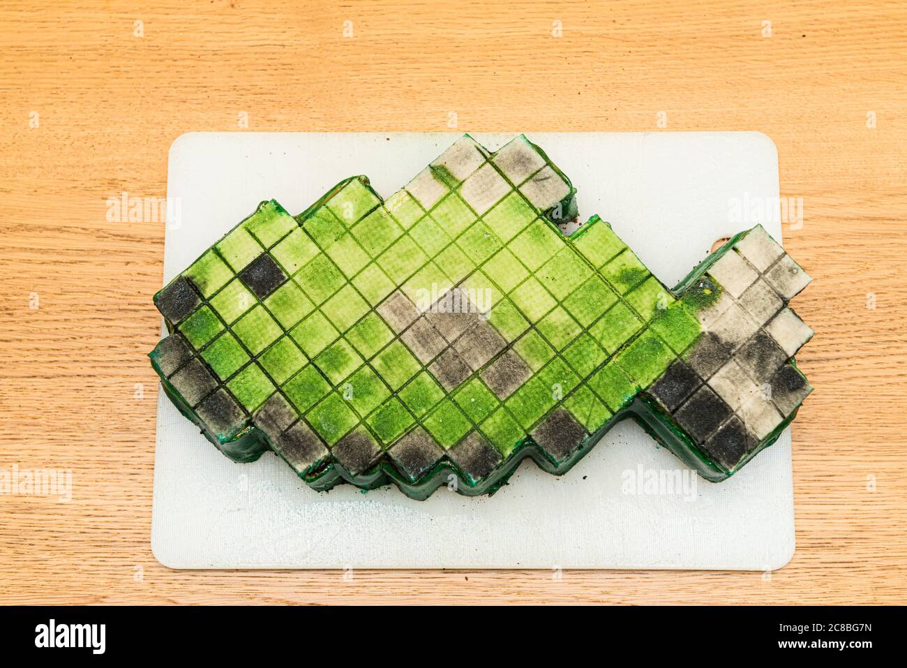 Chocolate cake formed as a pixelated fish Stock Photo - Alamy