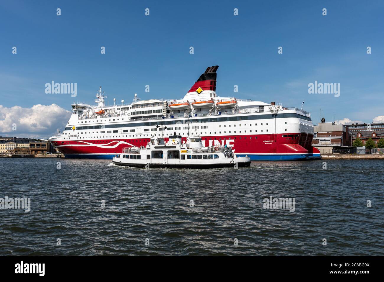 Suomenlinna ferry Suokki passing moored cruise ship M/S Gabriella of ...