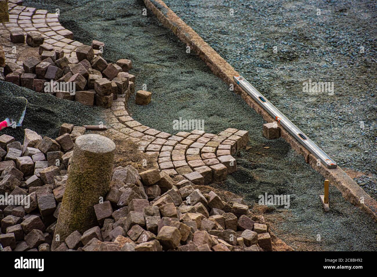 Cobblestone being removed to make a new section of pavement Stock Photo ...