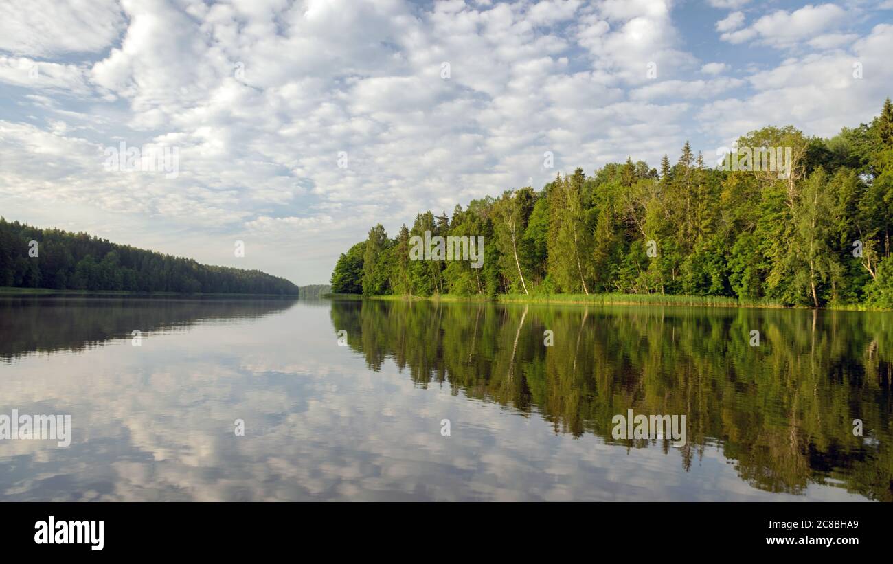 beautiful summer morning landscape on the lake, beautiful clouds and ...