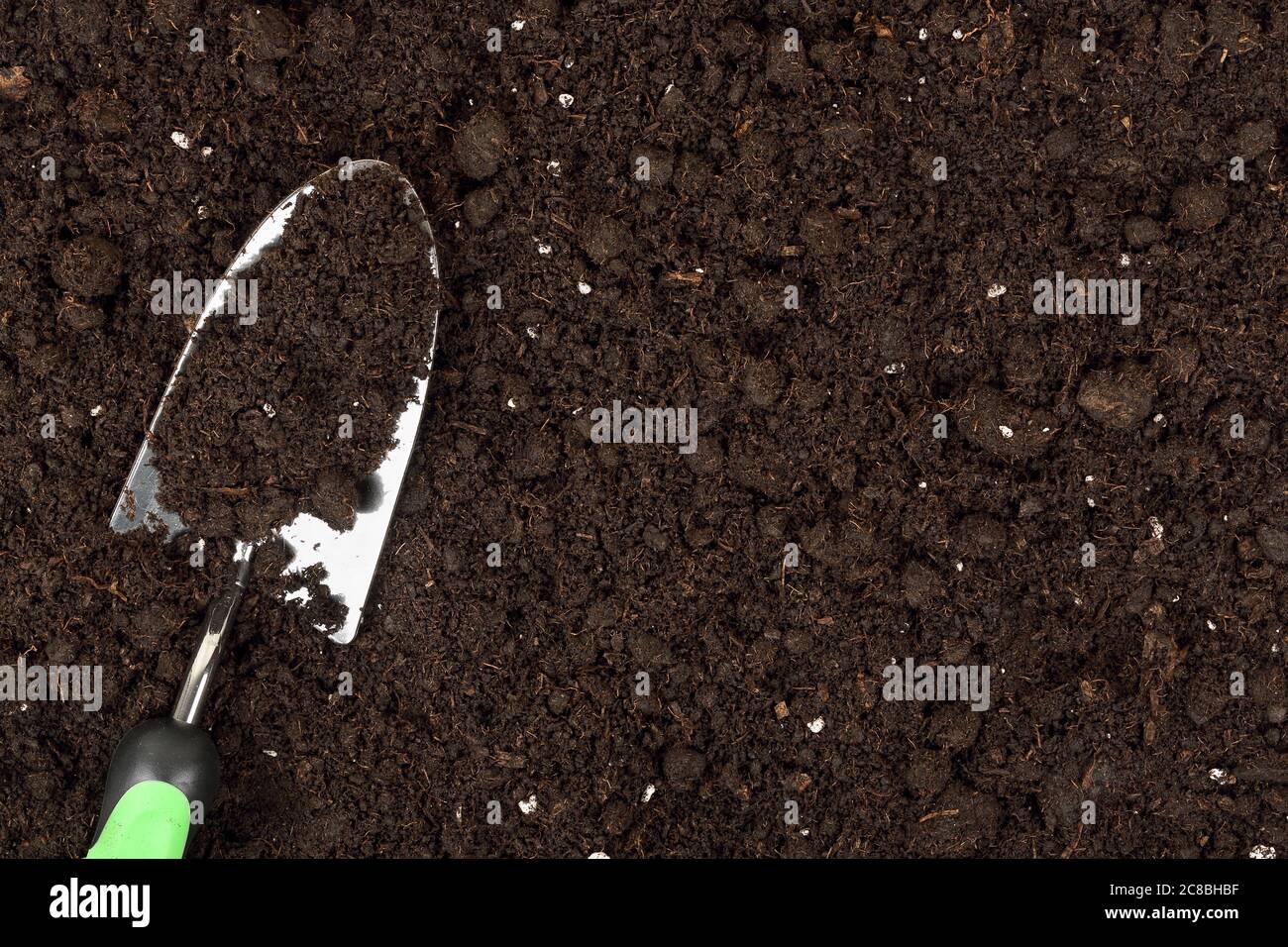 gardening spade on soil with copy space Stock Photo - Alamy
