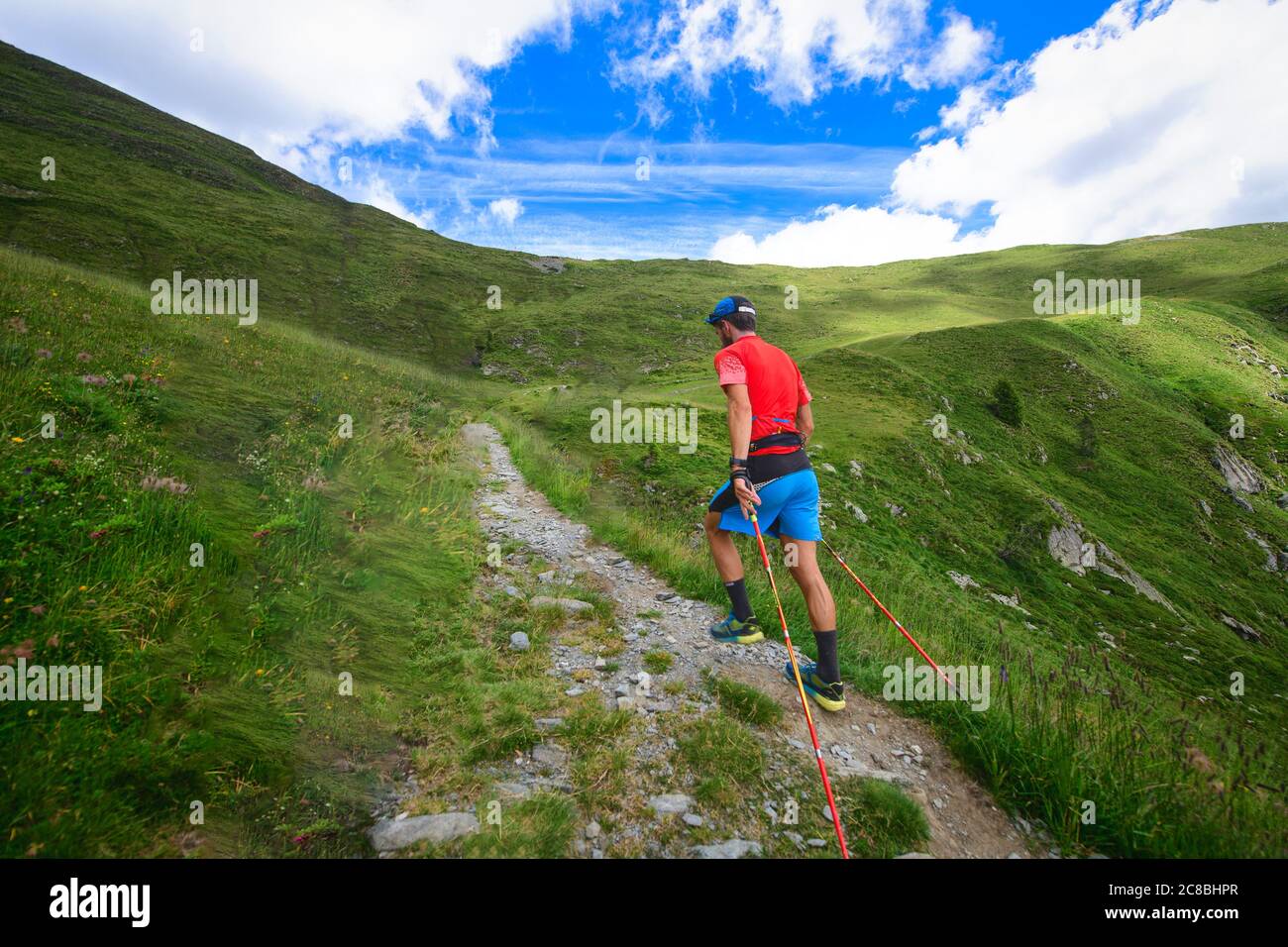 Nordic Walking on an uphill mountain path Stock Photo - Alamy