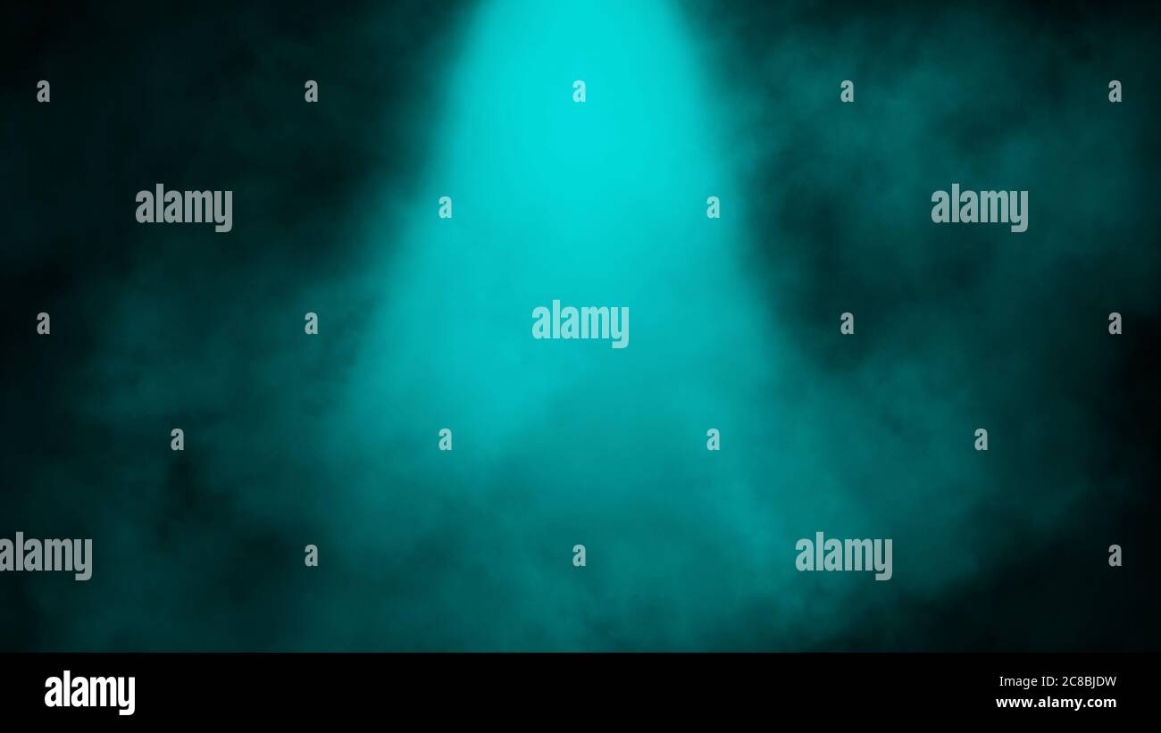 Abstract blue spotlight with smoke mist fog on a black background ...
