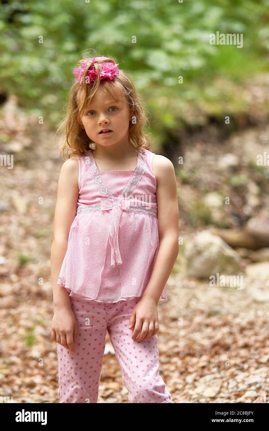 Little blonde girl posing Stock Photo - Alamy