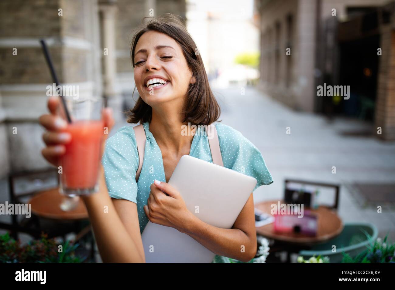 Beautiful young happy cheerful woman enjoying her time and freedom ...