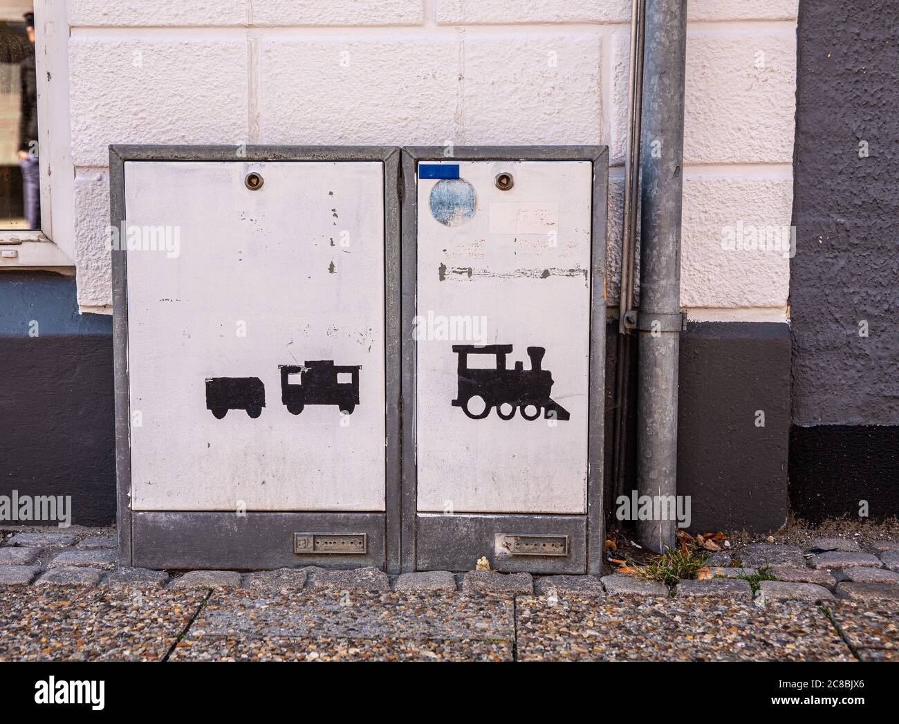 A train painted in black on an electrical box in the street Stock Photo ...