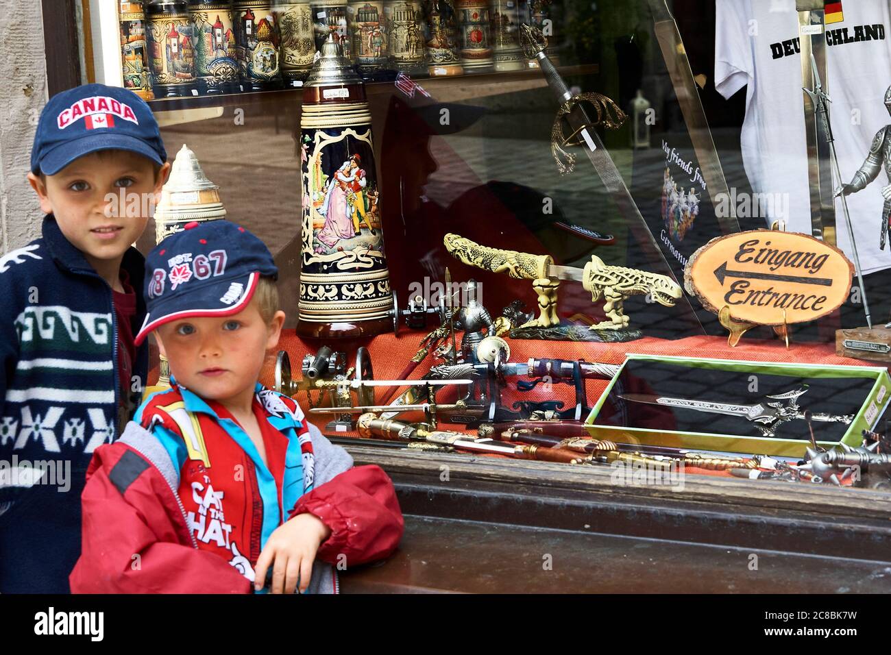 Two young boys window shopping. Medieval themes all around Rothenburg ...