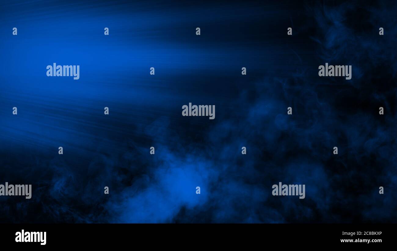 Abstract blue spotlight with smoke mist fog on a black background ...