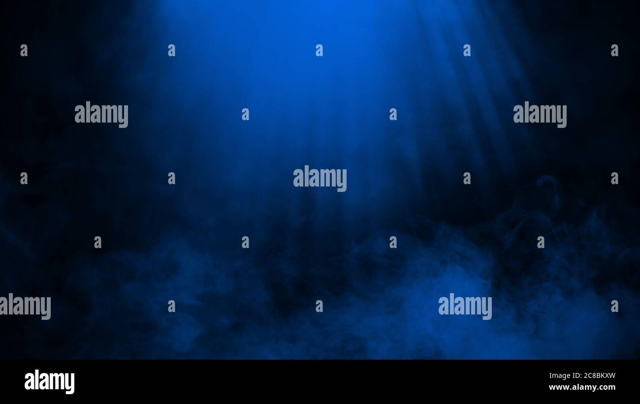 Abstract blue spotlight with smoke mist fog on a black background ...