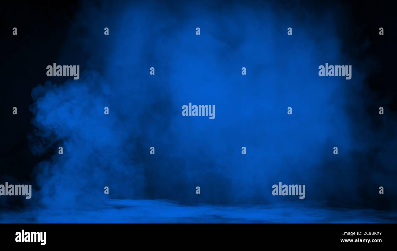 Abstract blue spotlight with smoke mist fog on a black background ...