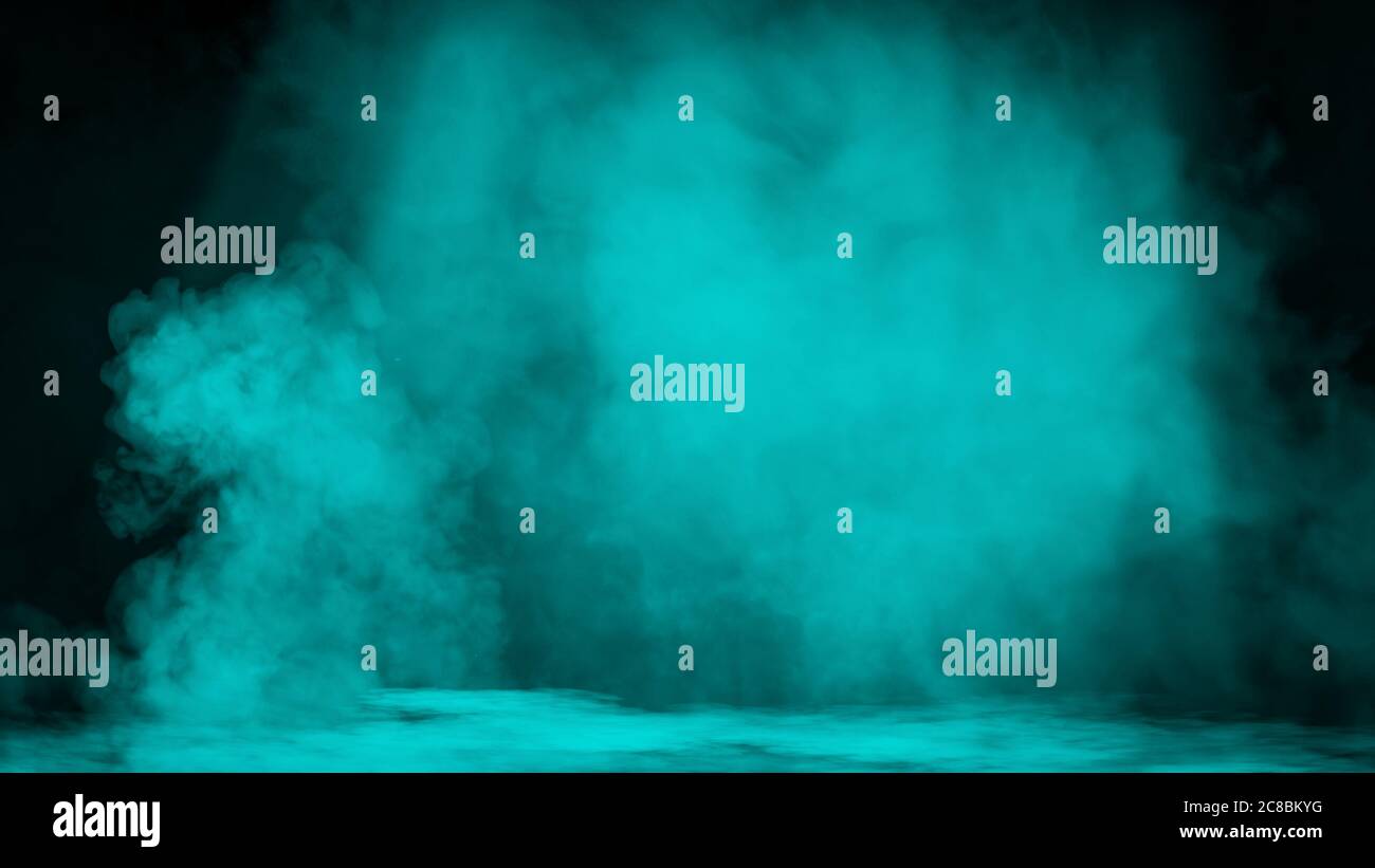 Abstract blue spotlight with smoke mist fog on a black background ...