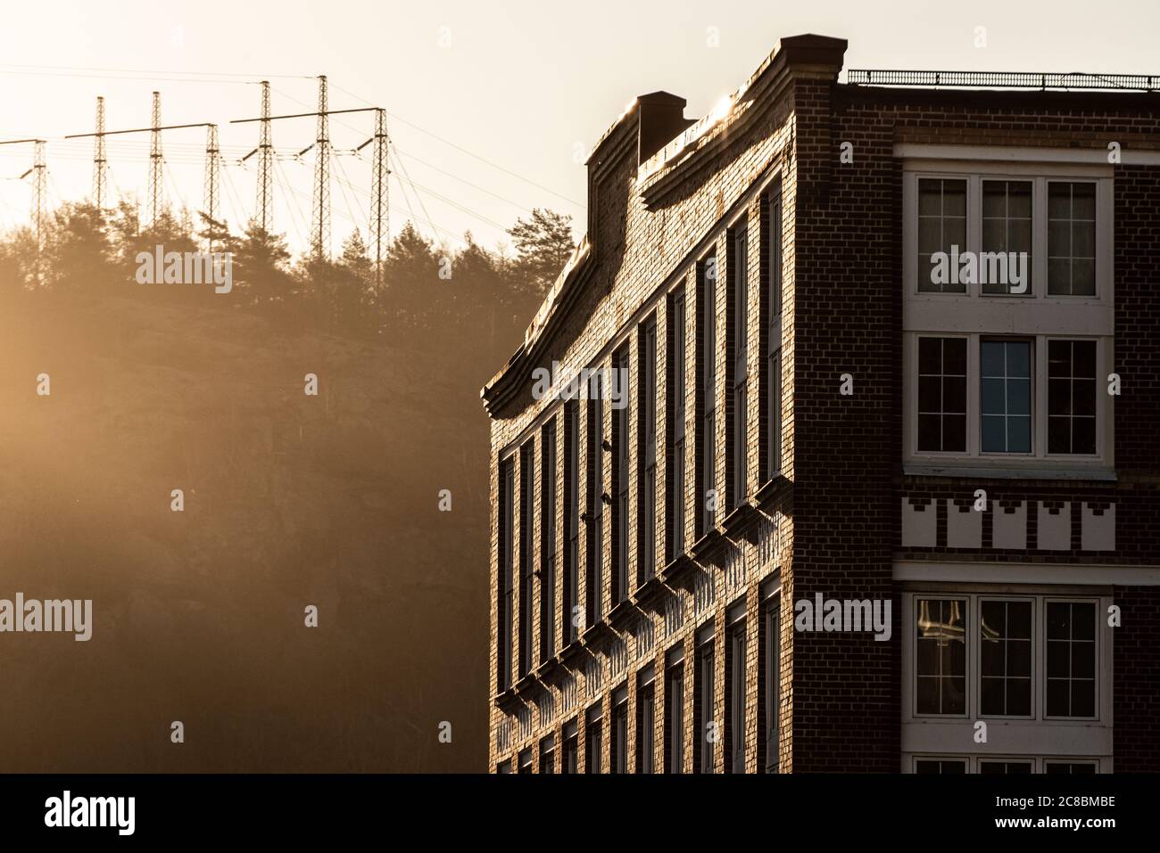 Sun shining on an old industrial building Stock Photo - Alamy