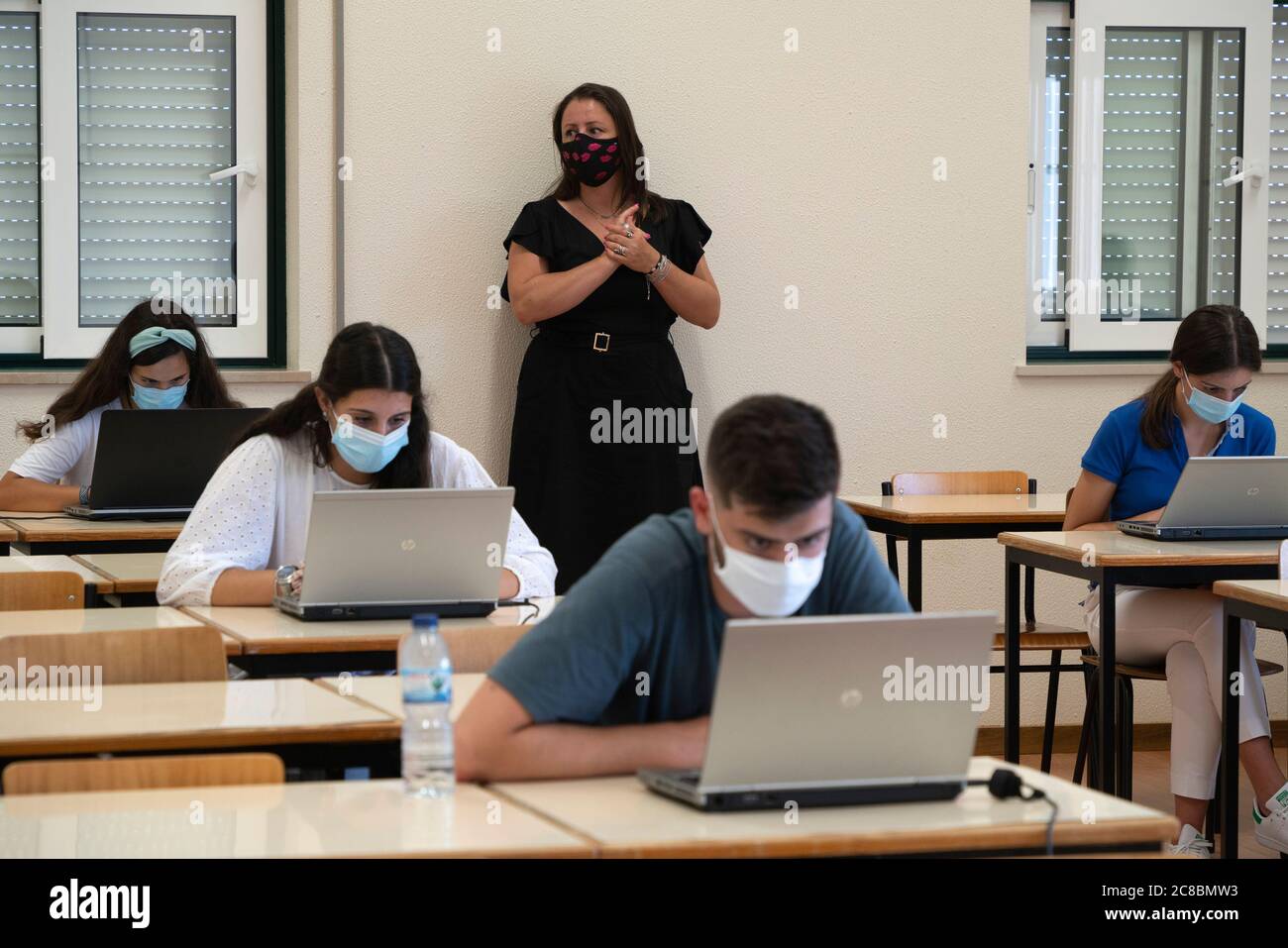 Students wearing face masks in class during the novel coronavirus COVID ...
