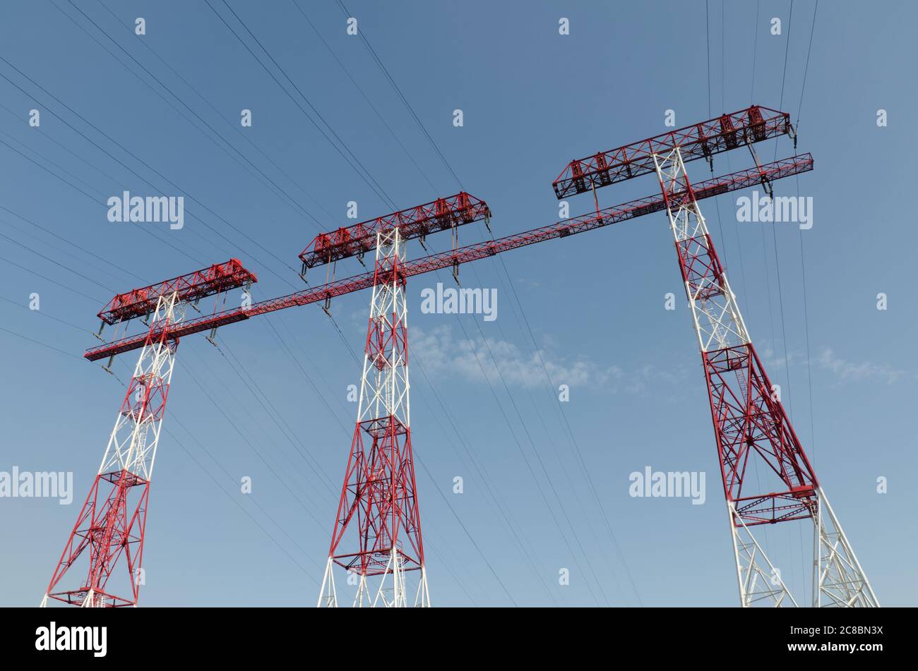 Three support power lines Stock Photo - Alamy