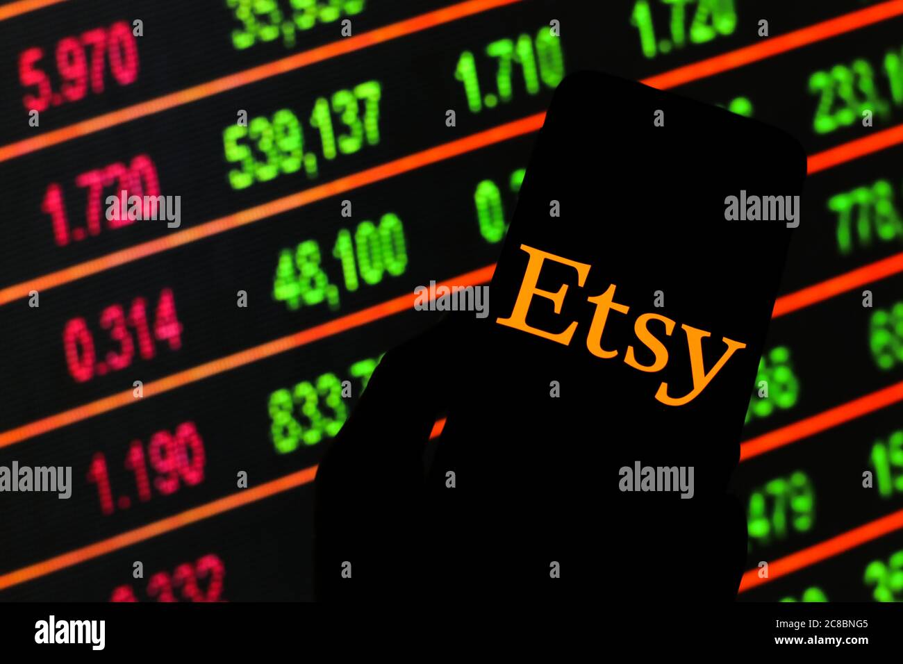 In this photo illustration an Etsy logo seen displayed on a smartphone ...