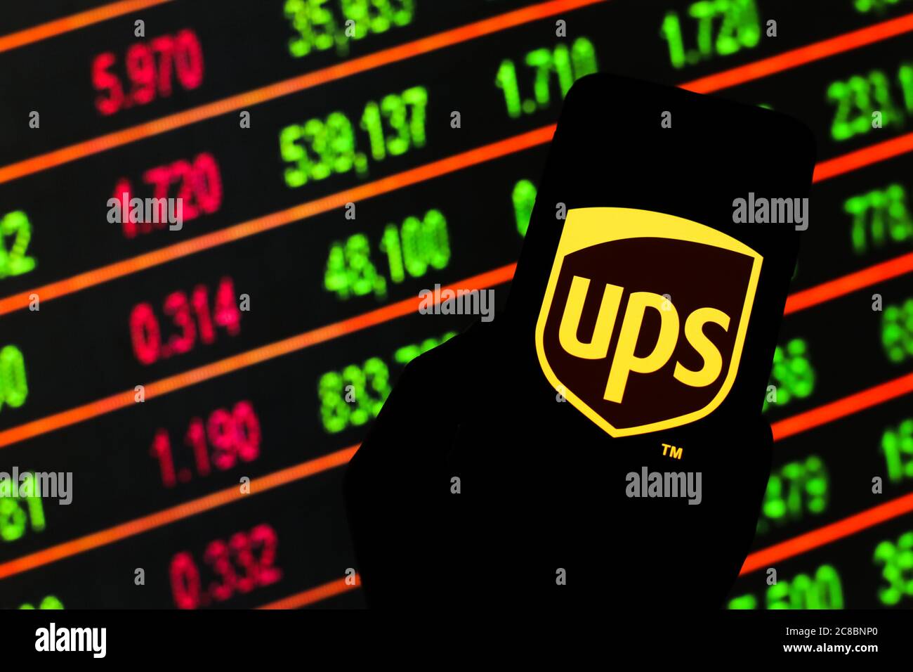 In this photo illustration an UPS shipping company logo seen displayed ...