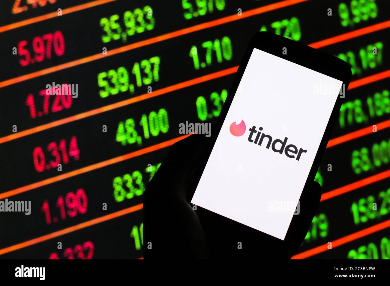 In this photo illustration a Tinder dating app logo seen displayed on a ...