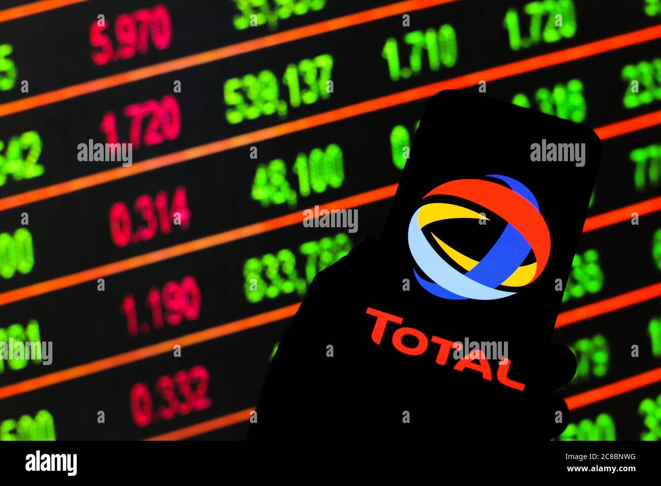 In this photo illustration a Total Oil logo seen displayed on a ...