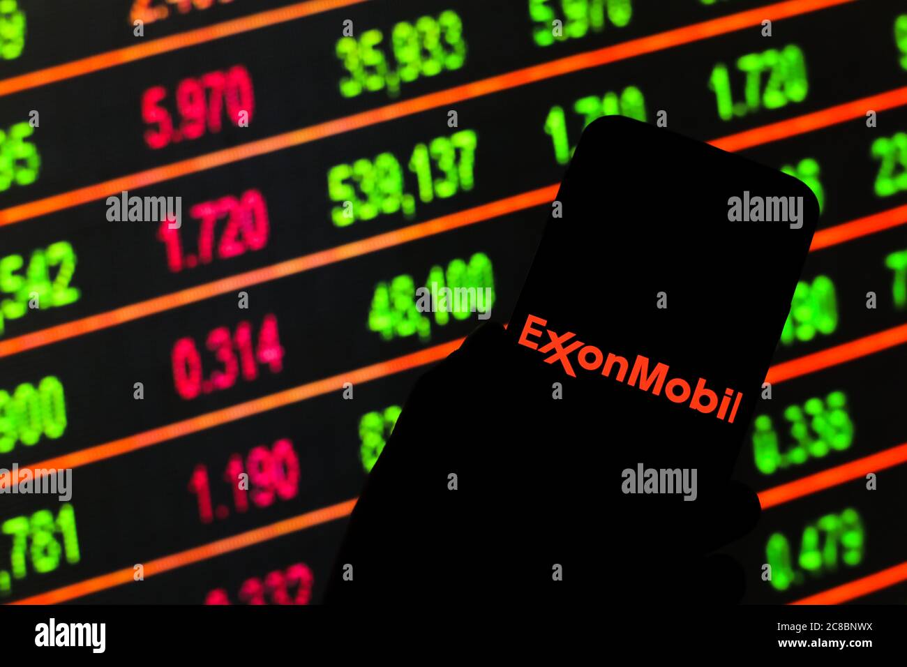 In this photo illustration an Exxon Mobil logo seen displayed on a ...