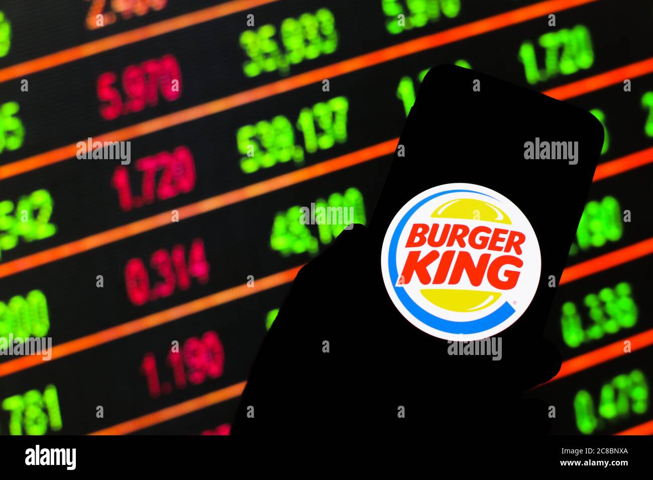 In this photo illustration a Burger King logo seen displayed on a ...