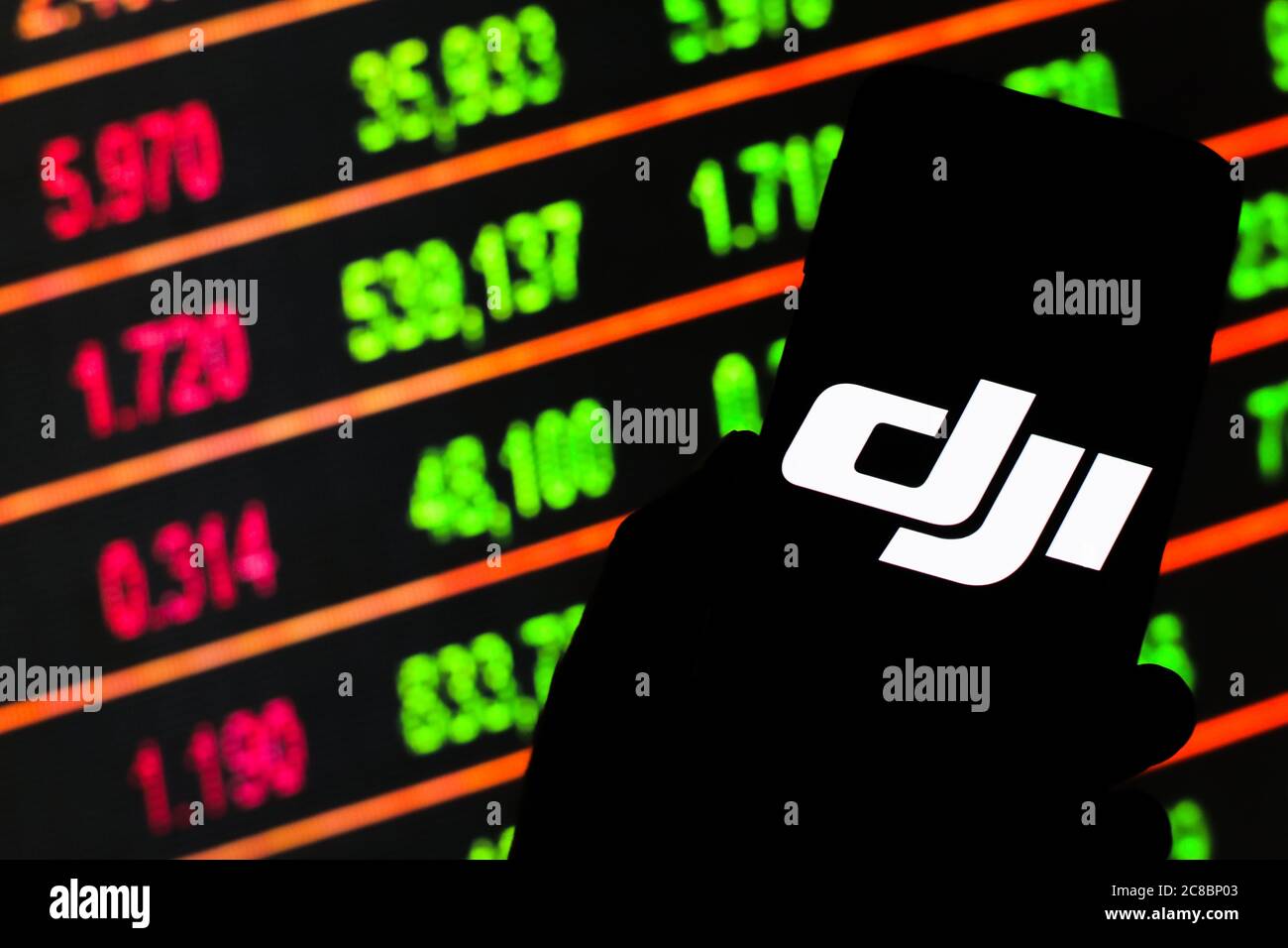 In this photo illustration a DJI logo seen displayed on a smartphone ...