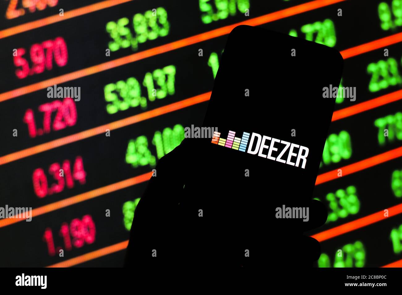 In this photo illustration a Deezer app logo seen displayed on a ...