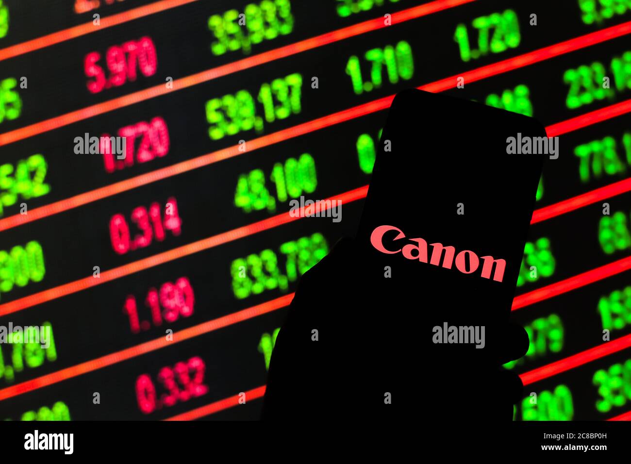 In this photo illustration a Canon logo seen displayed on a smartphone ...
