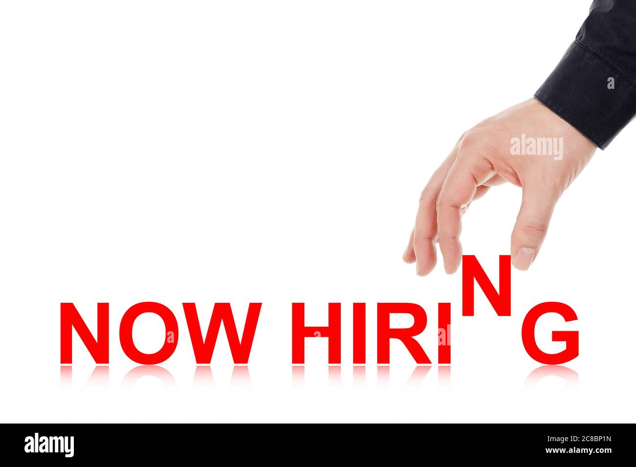 male hand placing letters to form the words now hiring Stock Photo - Alamy