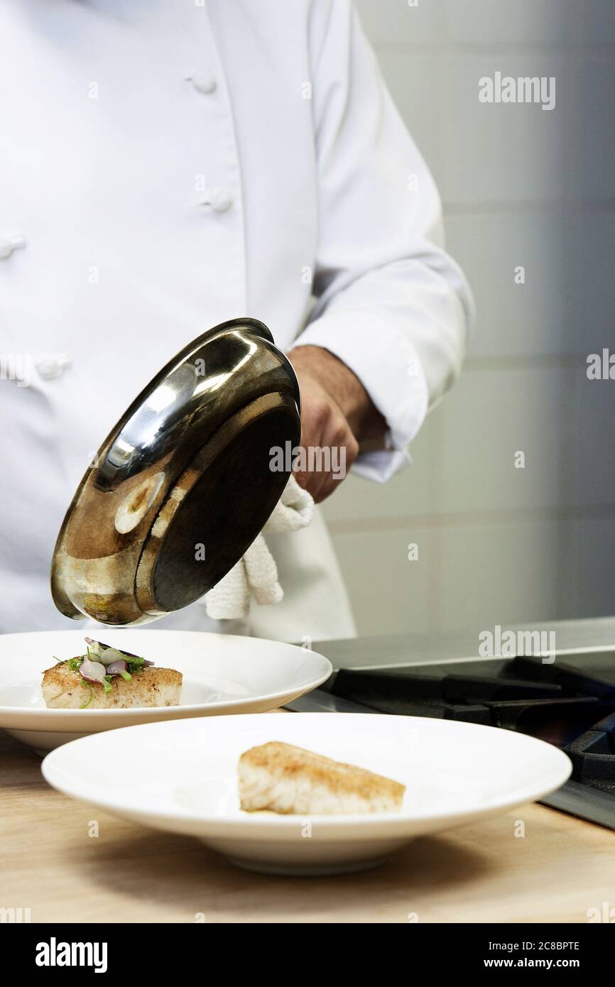 Collage of Chef cooking pan fried cod in kitchen Stock Photo - Alamy