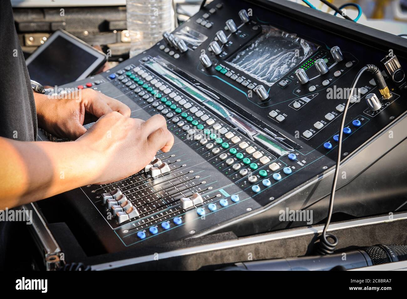 Hand adjusting on a professional audio mixer Stock Photo - Alamy