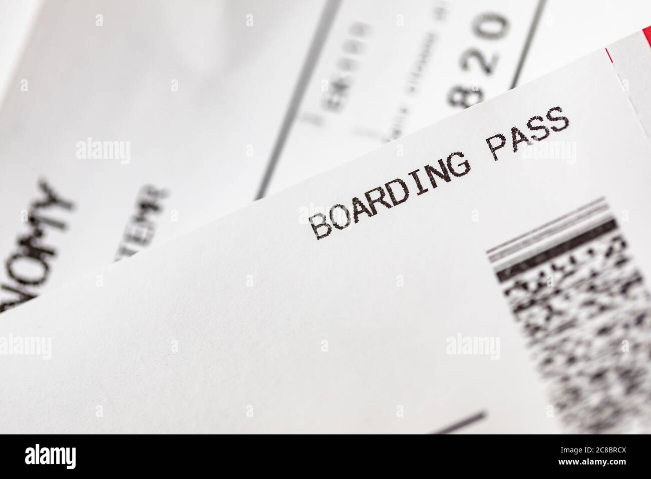 Paper boarding pass isolated on blurred background. Airline boarding ...