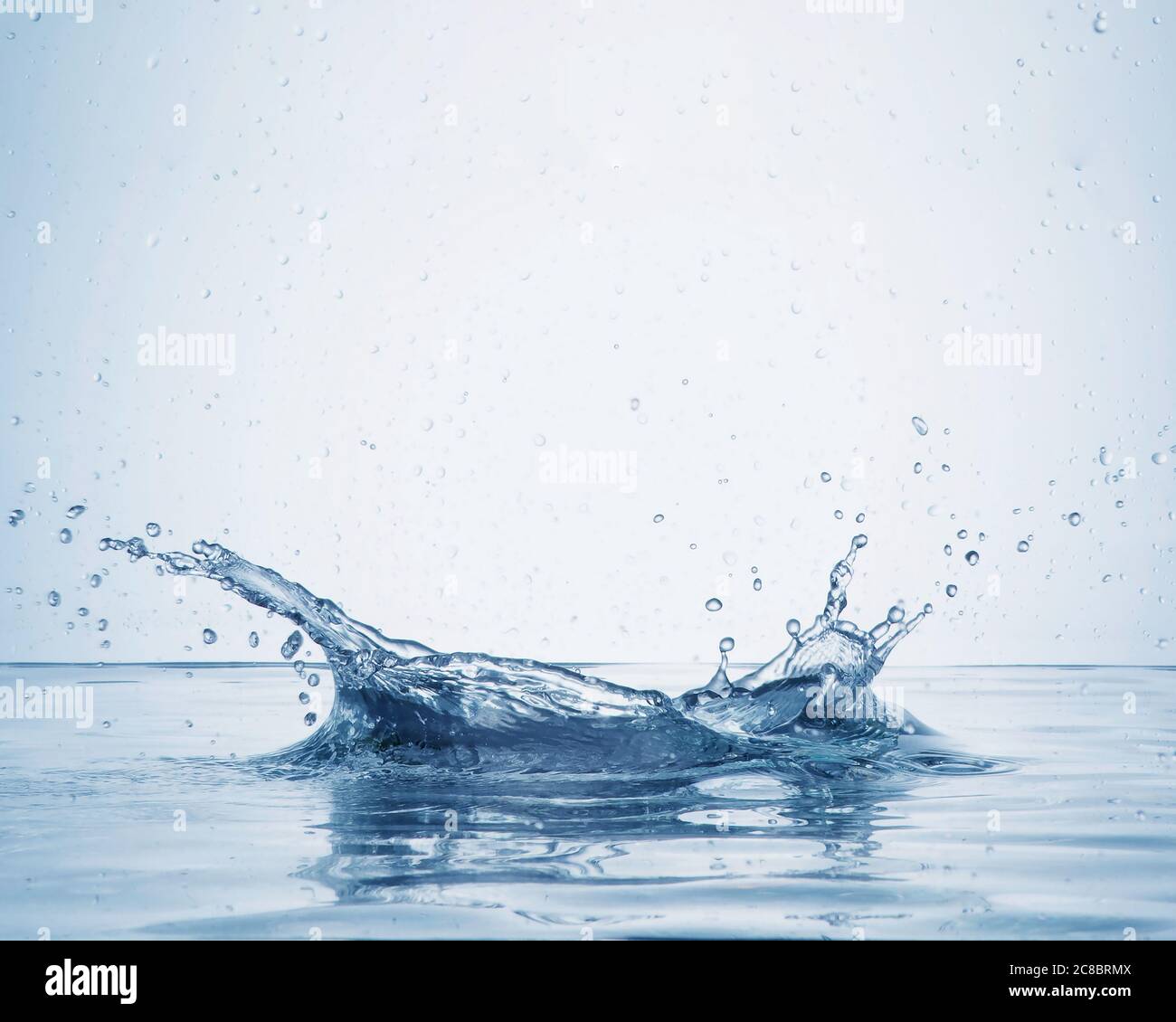 a scene in which drops of water splash after dropping an object in the ...
