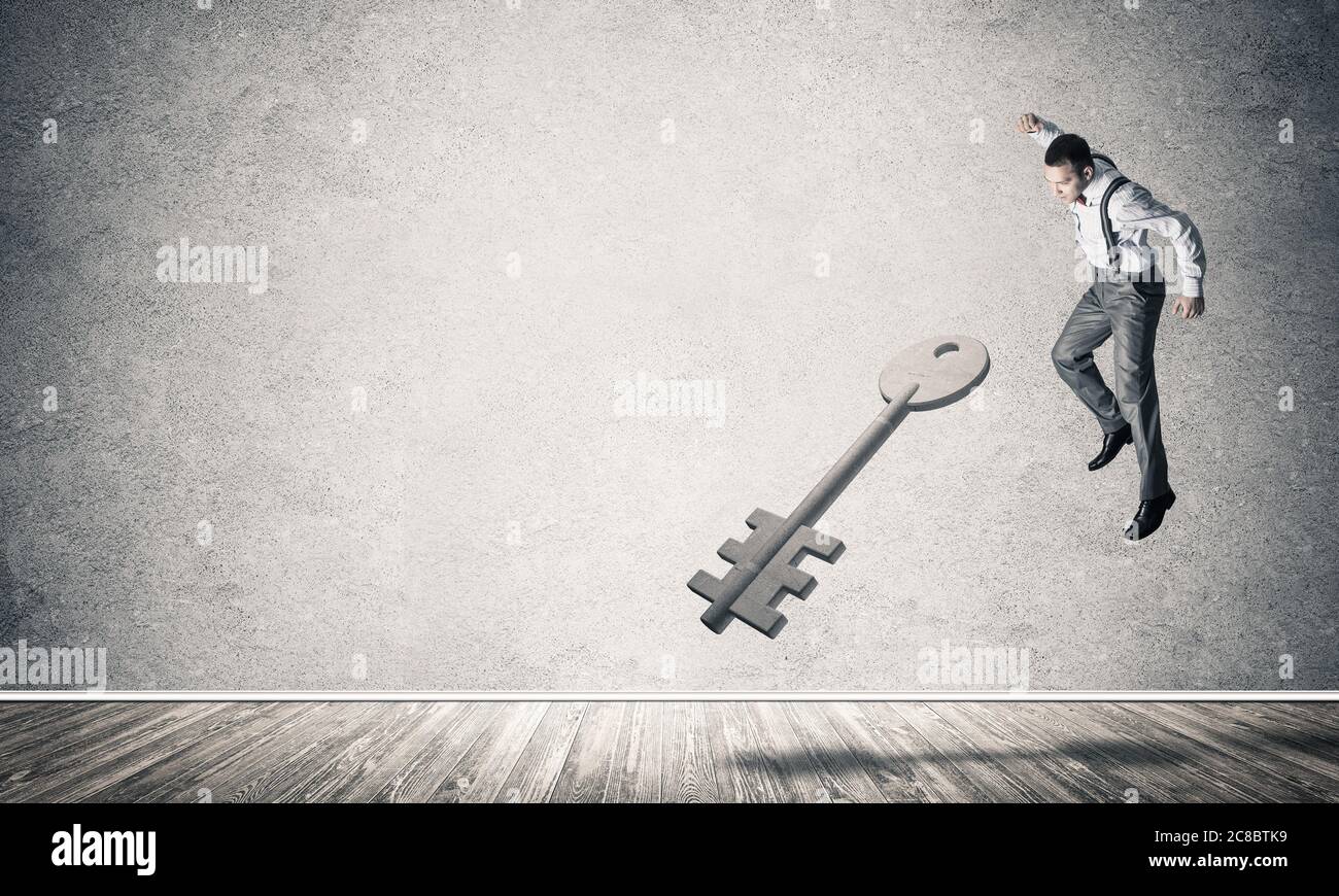 Breaking through access concept with man in room crashing concrete key ...