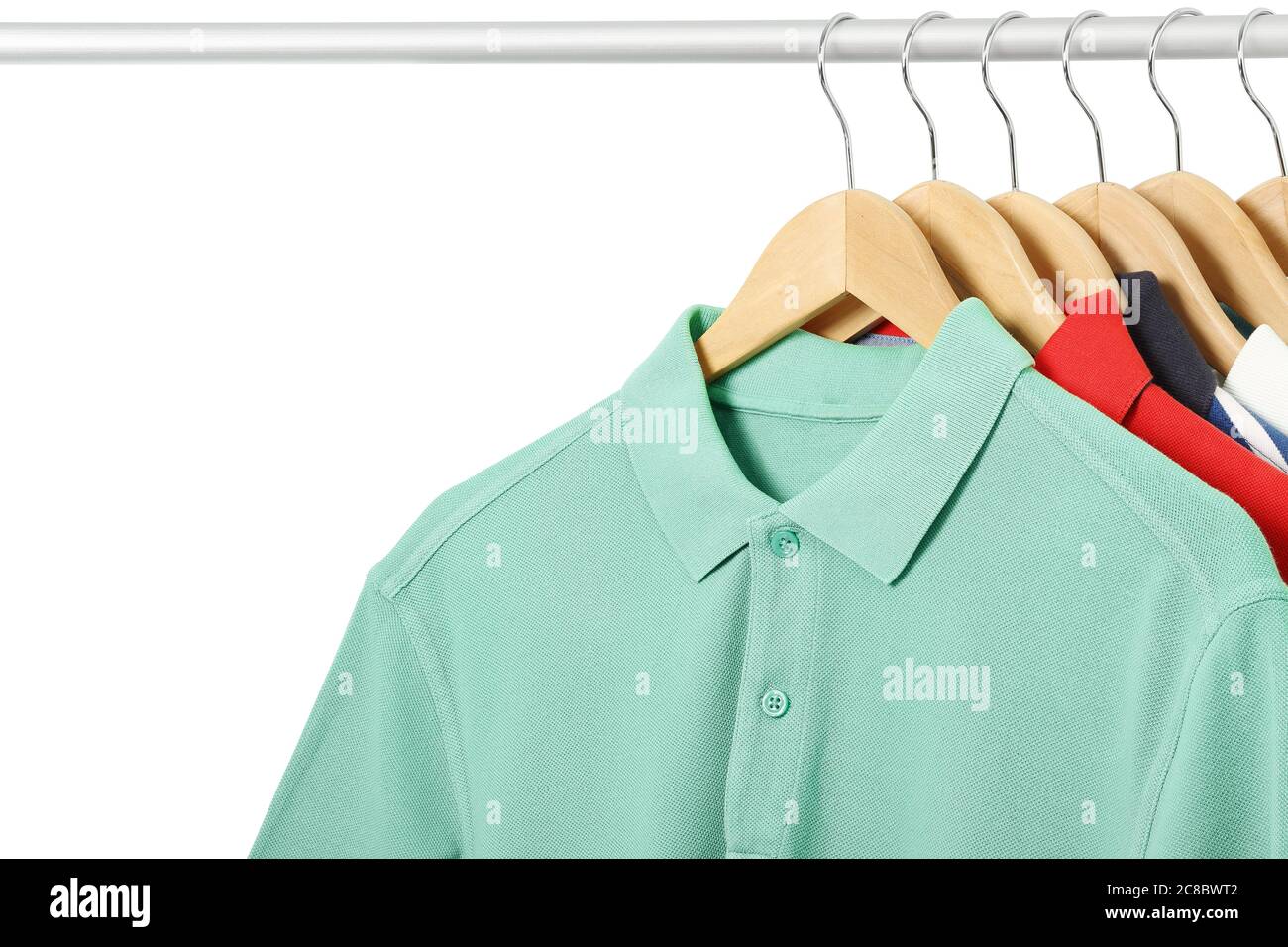 variety of polo shirts on hangers isolated Stock Photo - Alamy