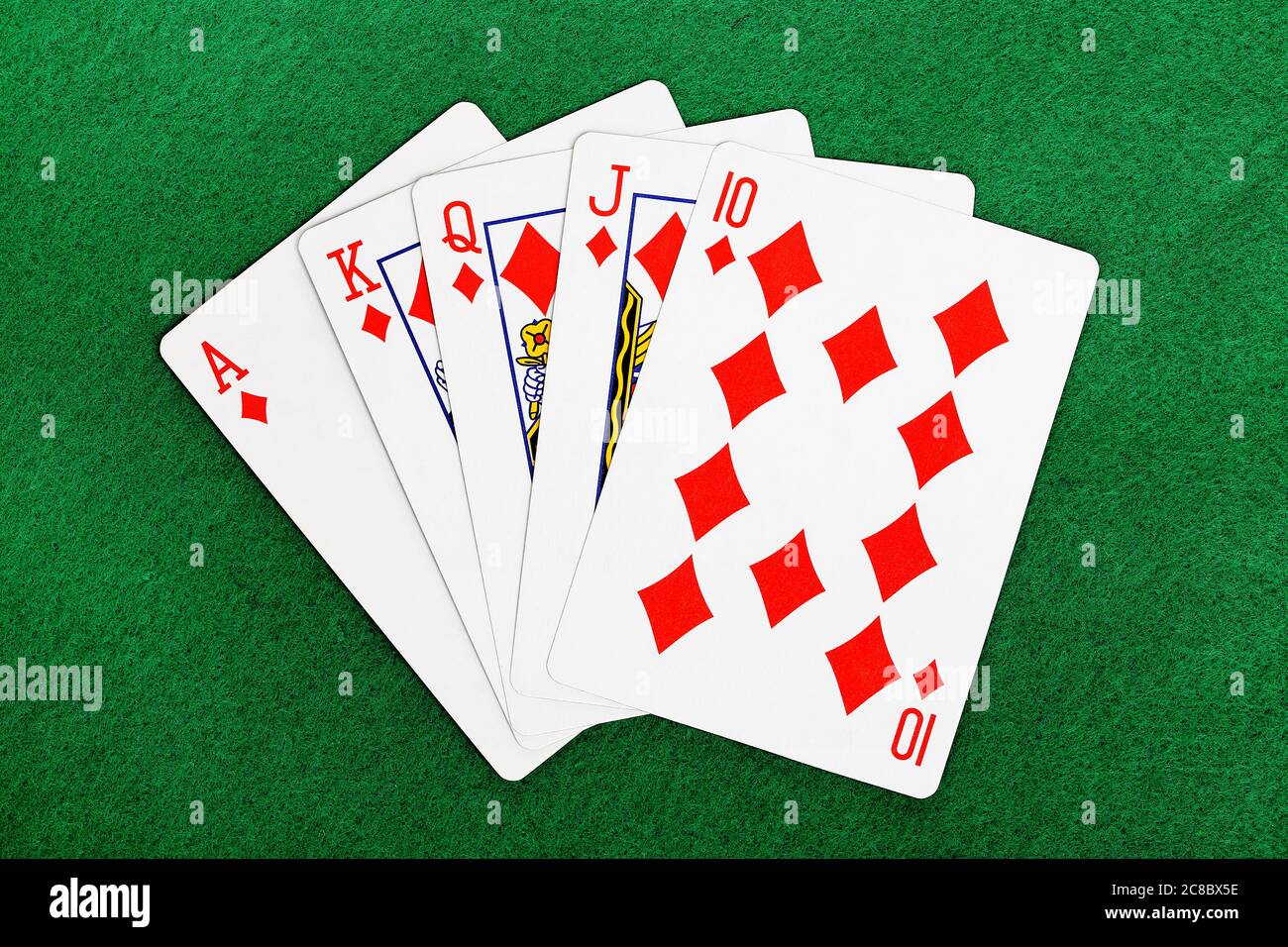 royal flush poker hand on felt texture Stock Photo - Alamy