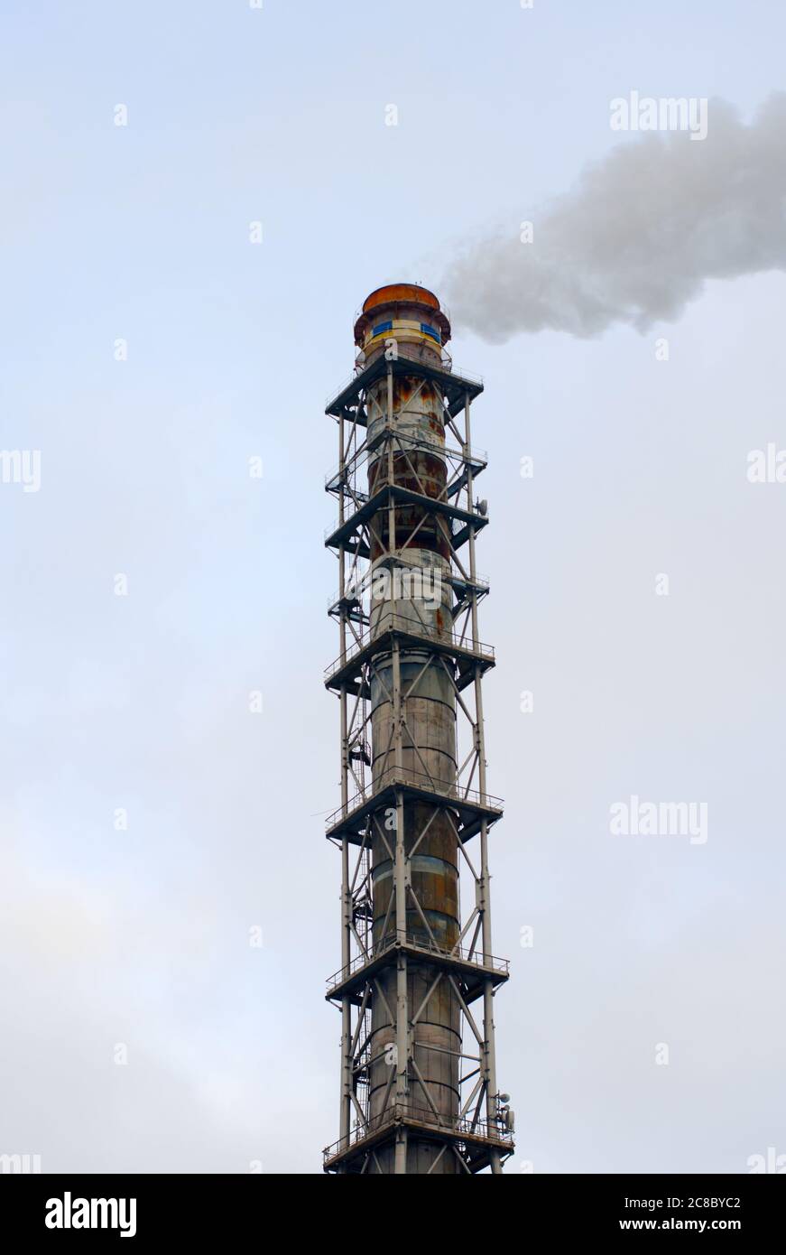 Fuming factory chimney Stock Photo - Alamy