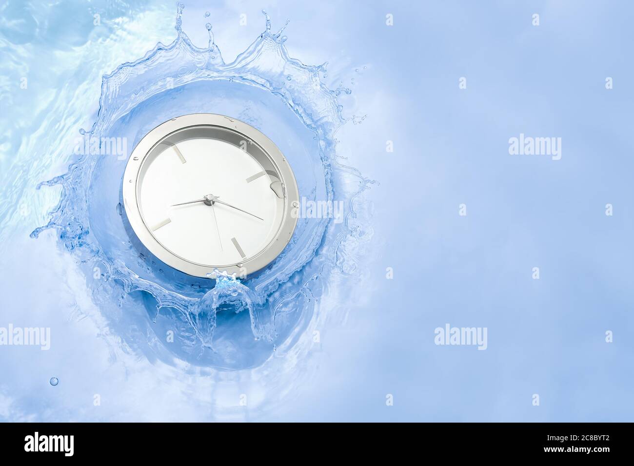 chrome clock splashing in water, abstract time concept Stock Photo - Alamy