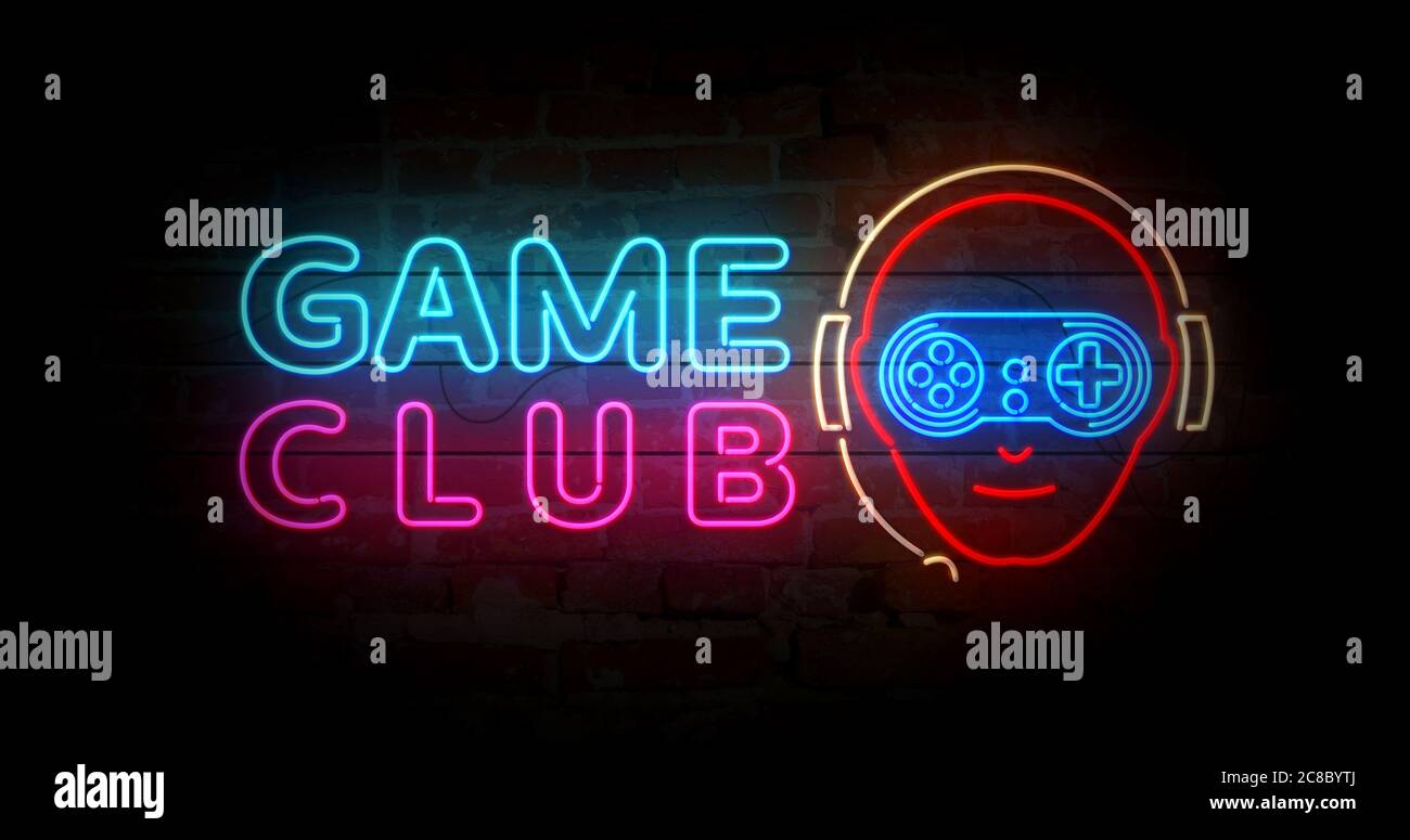Game club with gamer symbol neon symbol on brick wall. Light bulbs with ...