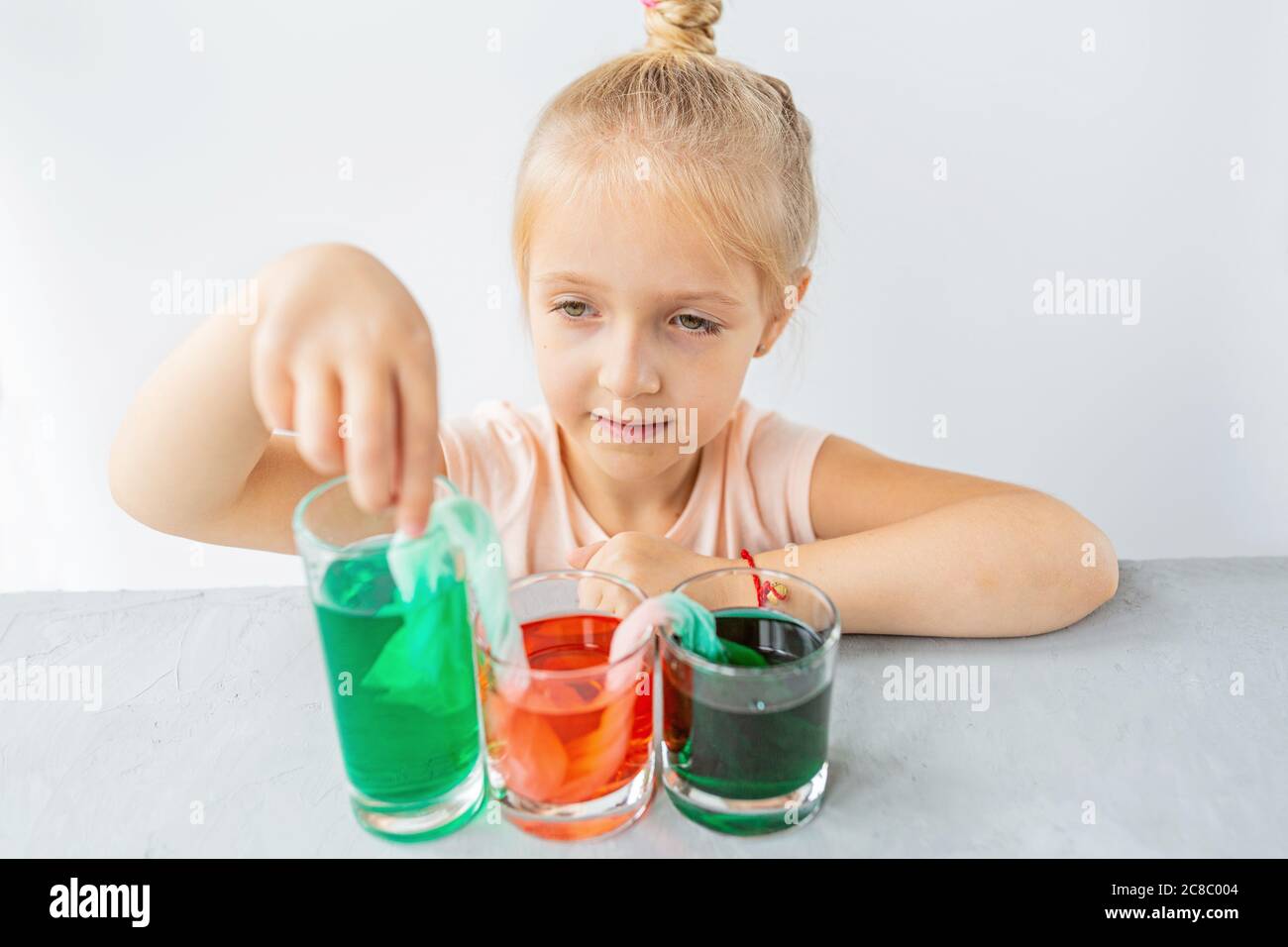 cute little girl six years old doing laboratory experiment with ...