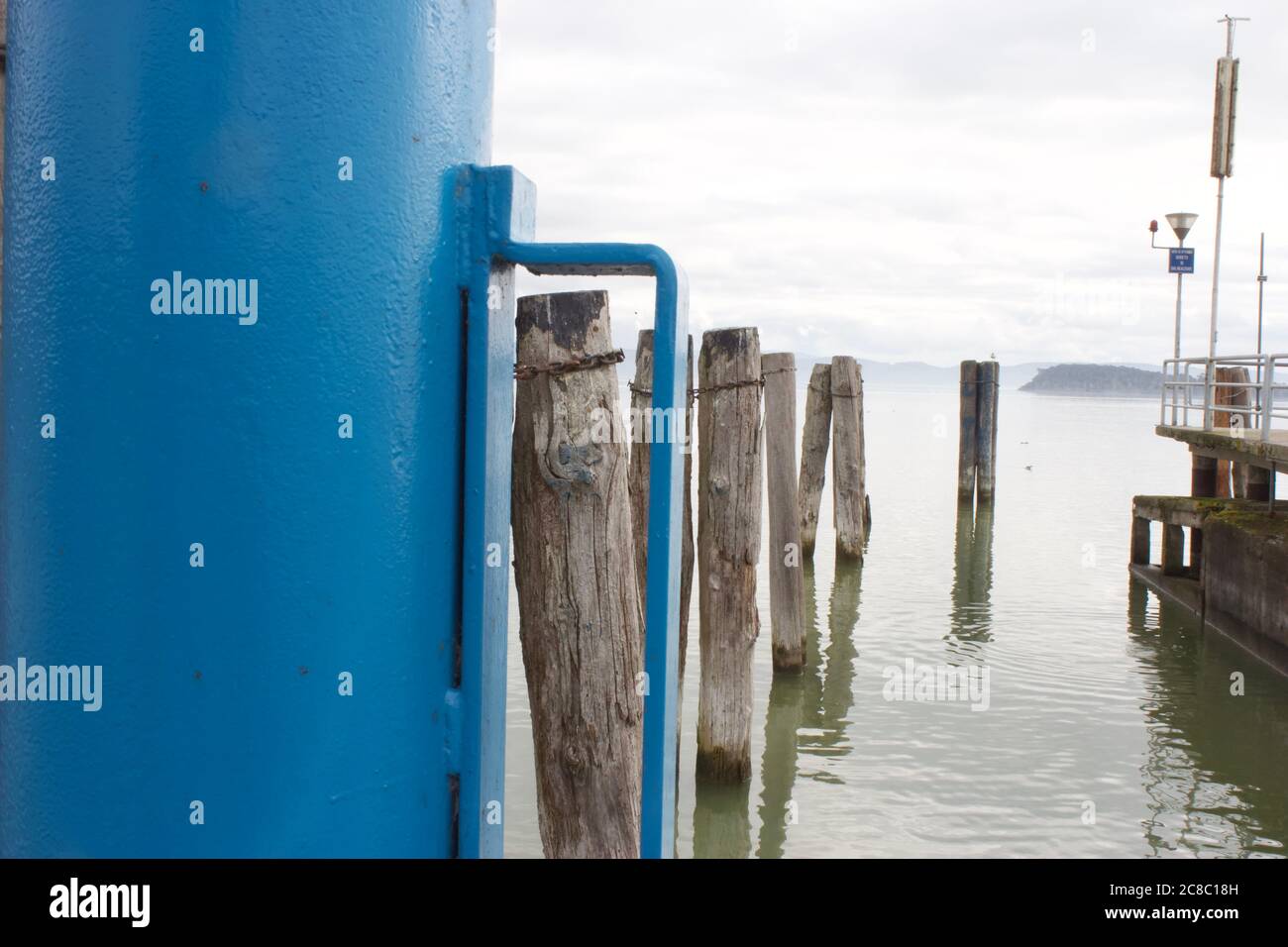 vertical poles on the water Stock Photo - Alamy