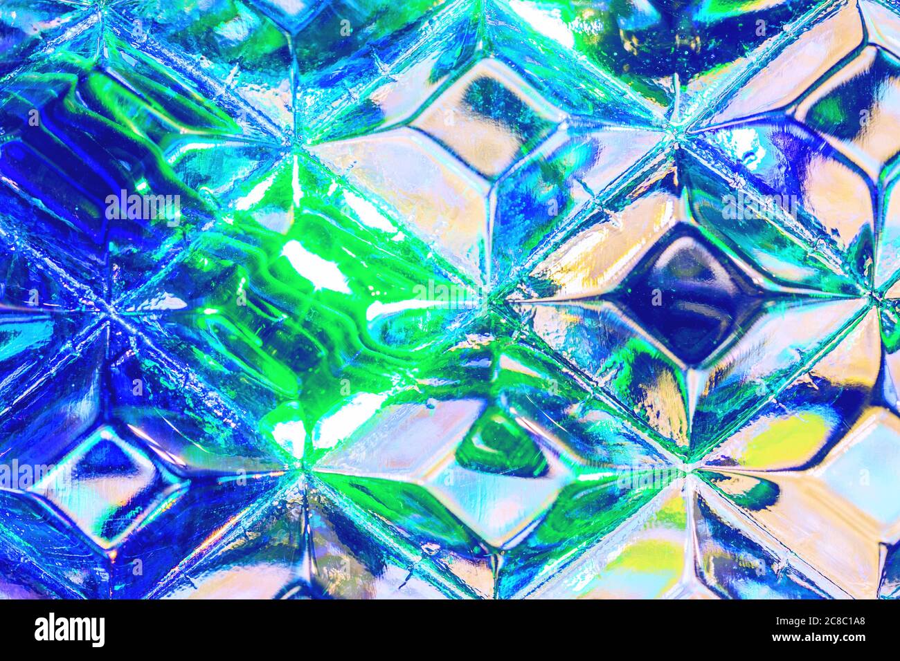 Lights of garland, reflected in the crystal. Glowing texture. Abstract ...