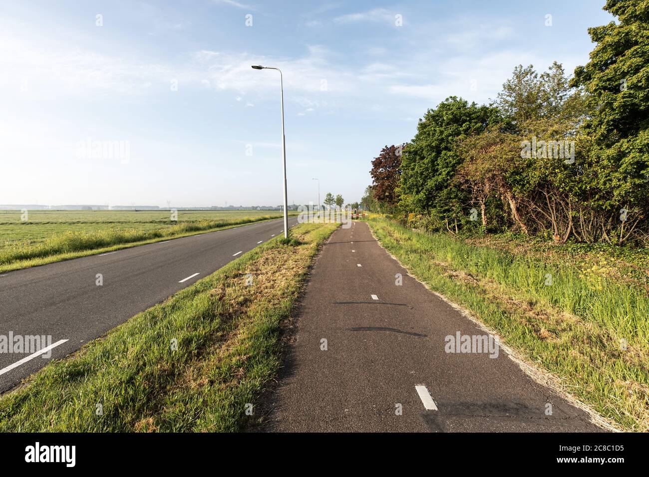 Scenic landscape view with a lonely road leading to the horizon of the ...