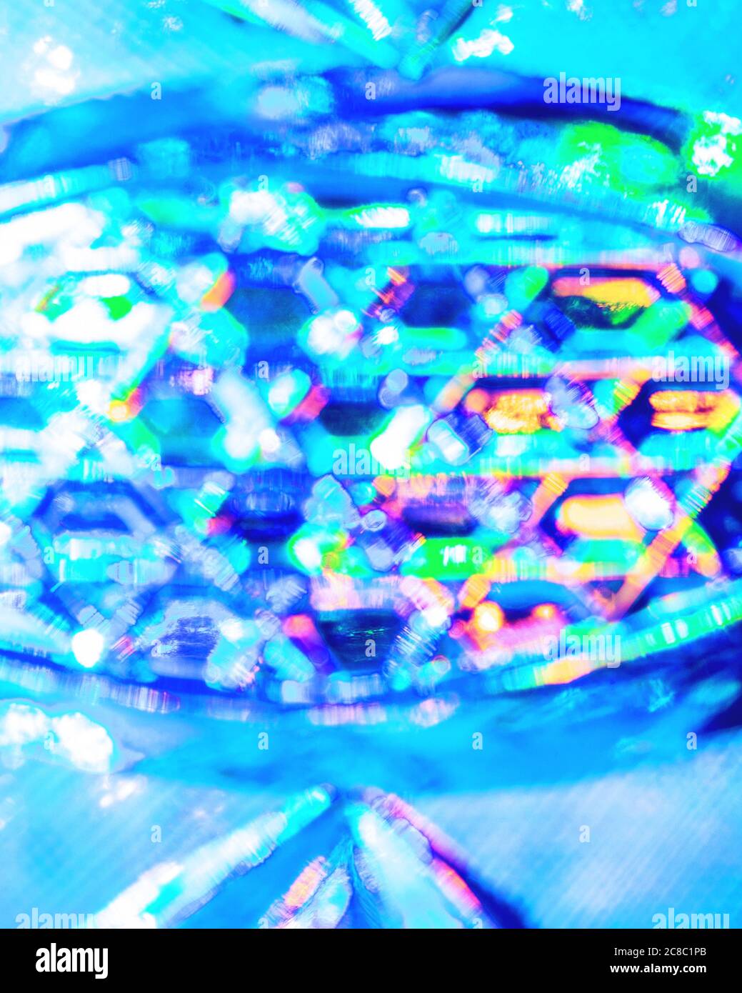 Lights of garland, reflected in the crystal. Glowing texture. Abstract ...