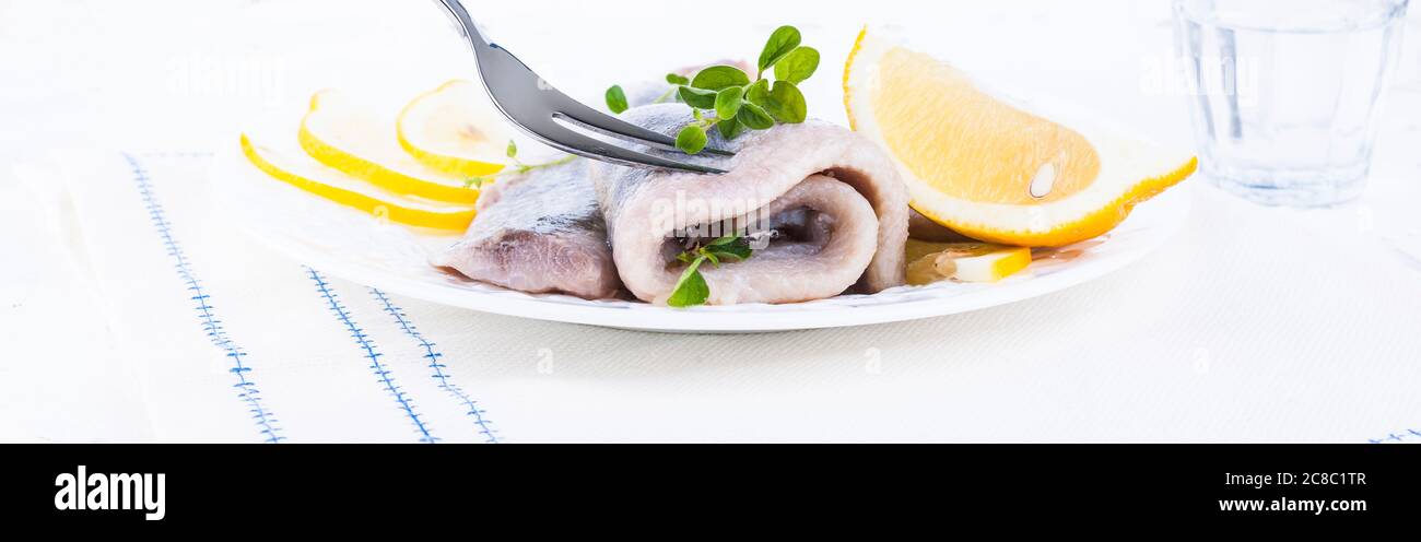 Dutch herring. Traditional Dutch food, marinated fish fillet with onion ...
