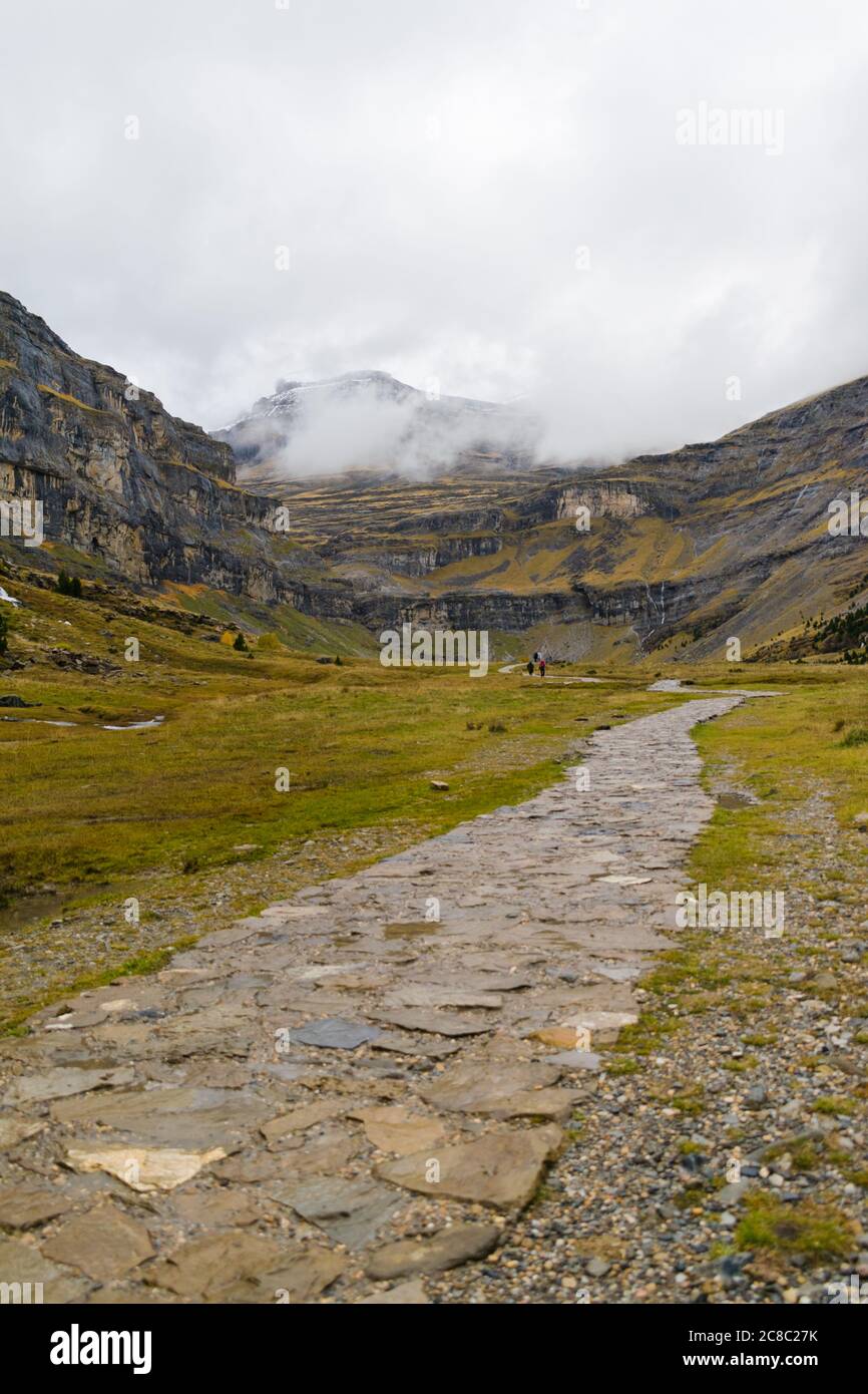 Long stone path in a valley between mountains Stock Photo - Alamy