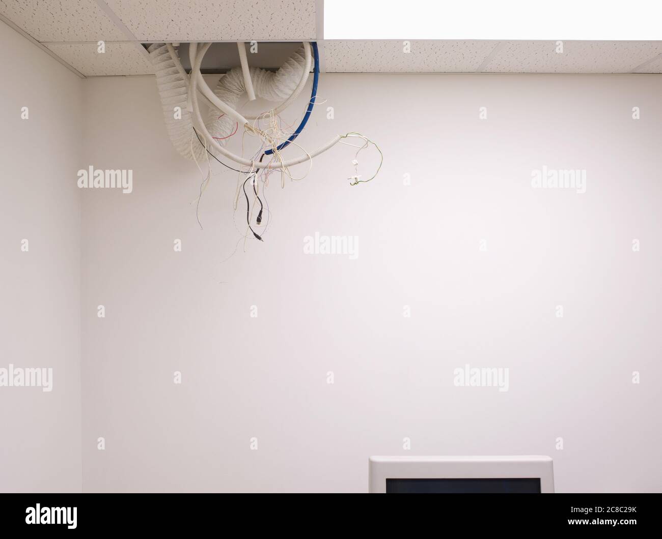 Tangled Hanging from Office Ceiling Stock Photo - Alamy